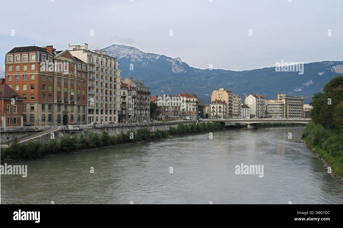 The picture shows a view from a bridge of the Isere River in Grenoble ...