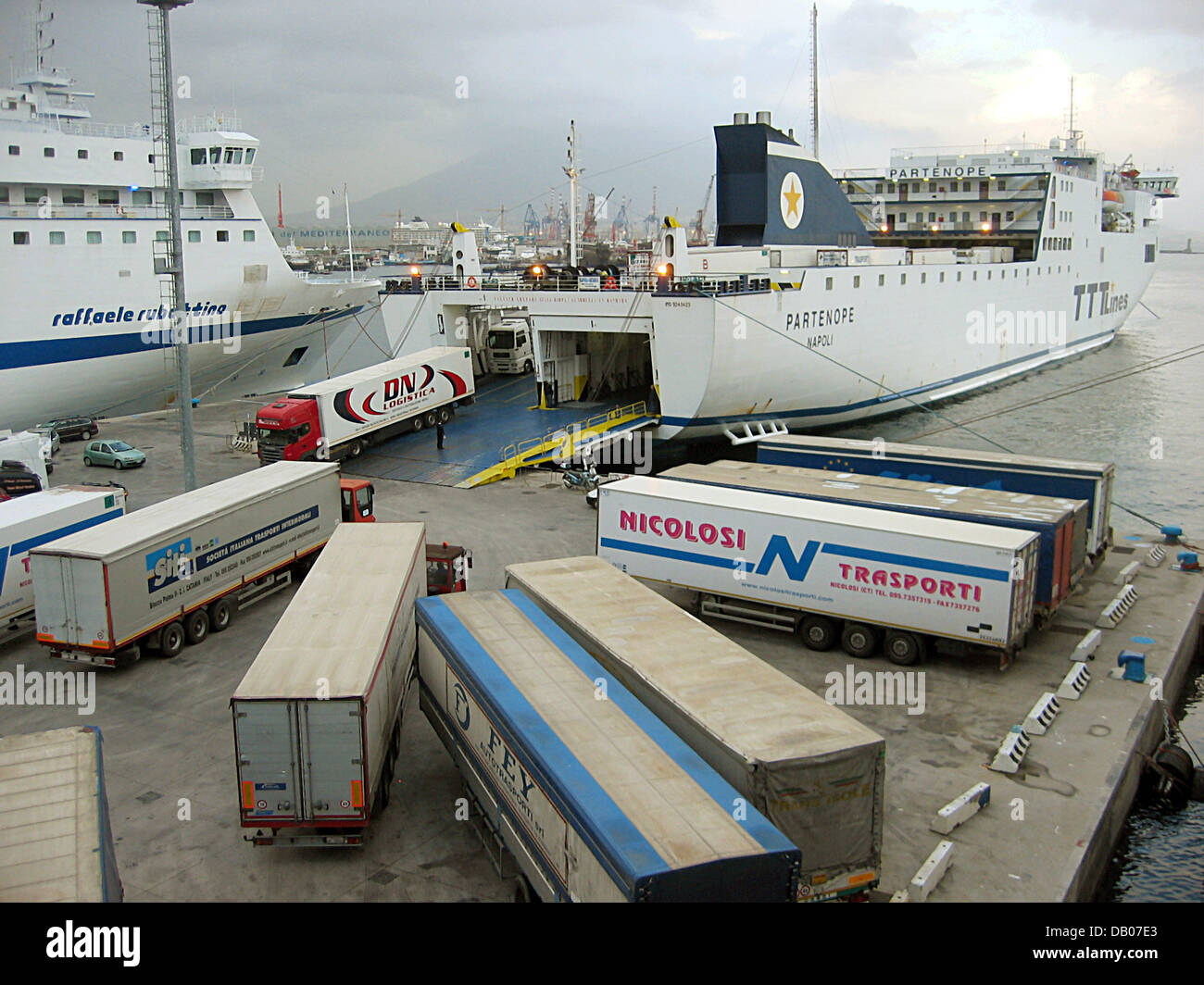 The picture shows container being loaded onto a ferry at the port of ...