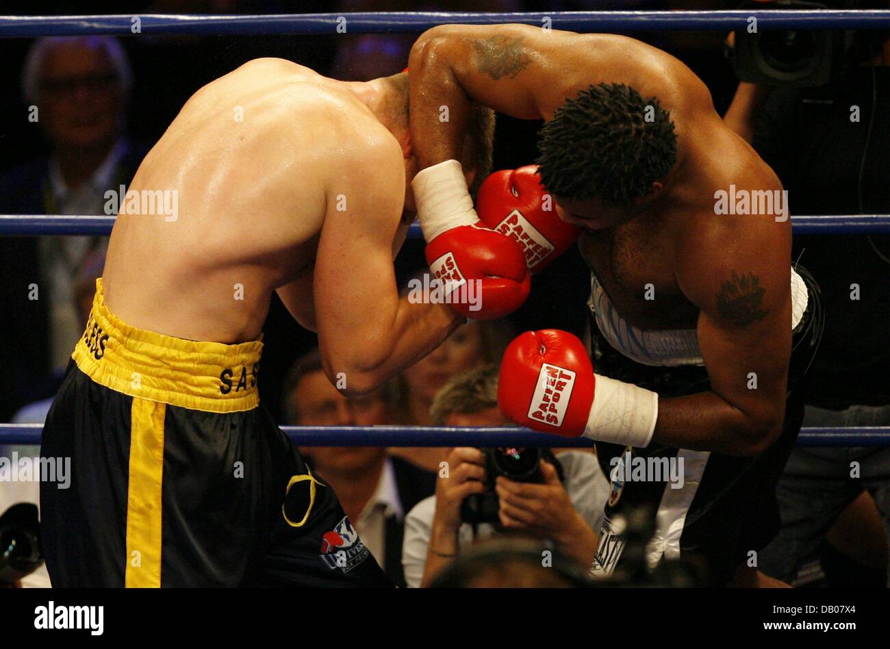 Ukrainian heavy weight boxer Alexander Dimitrenko (L) fights US-American Malcolm Tann in a WBO ...