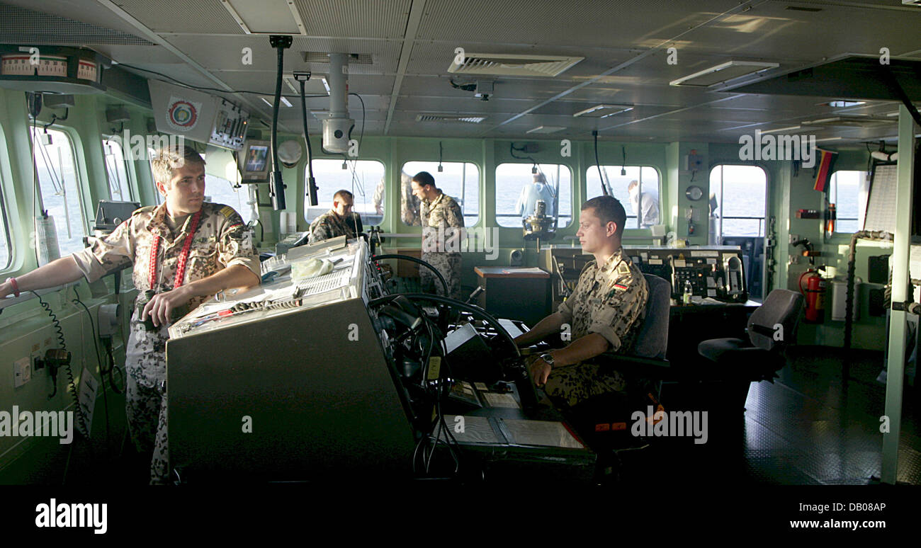 The bridge of German Navy frigate 'Schleswig-Holstein' is busy offshore ...