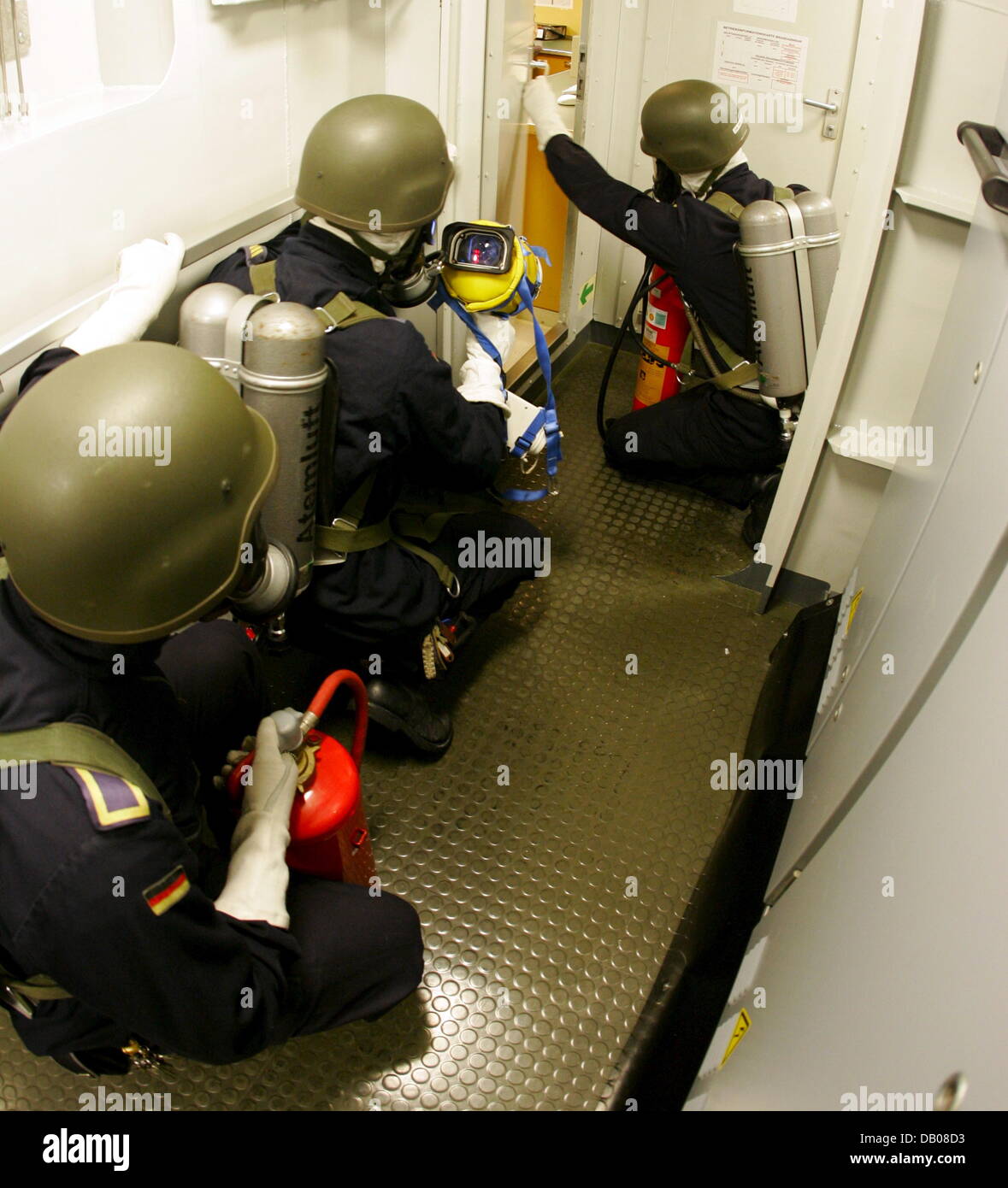 German Navy soldiers train a fire fighting on frigate 'Schleswig ...