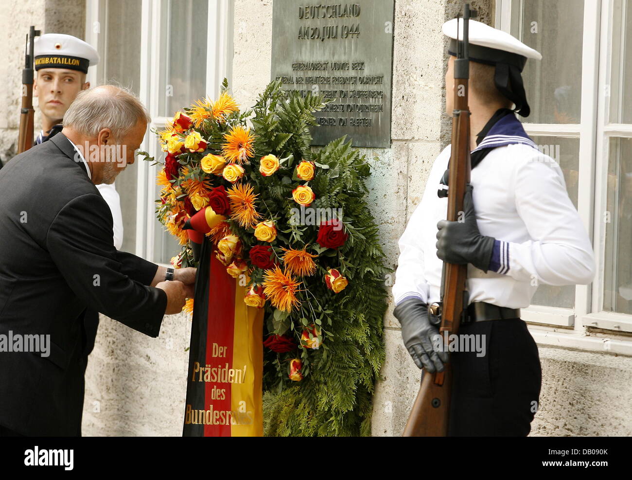 President of the German Federal Council Harald Ringstorff (L) lays a ...