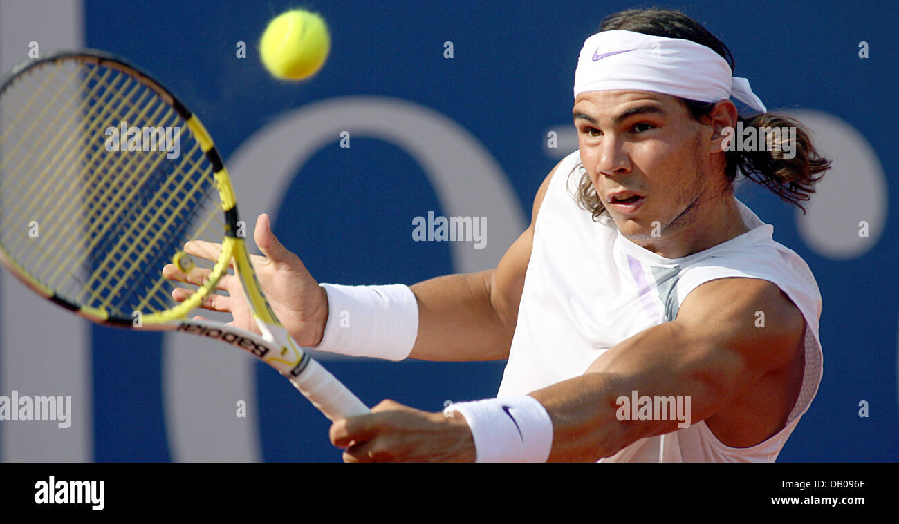 Spanish tennis pro Rafael Nadal hits a forehand in his quarter-finals ...