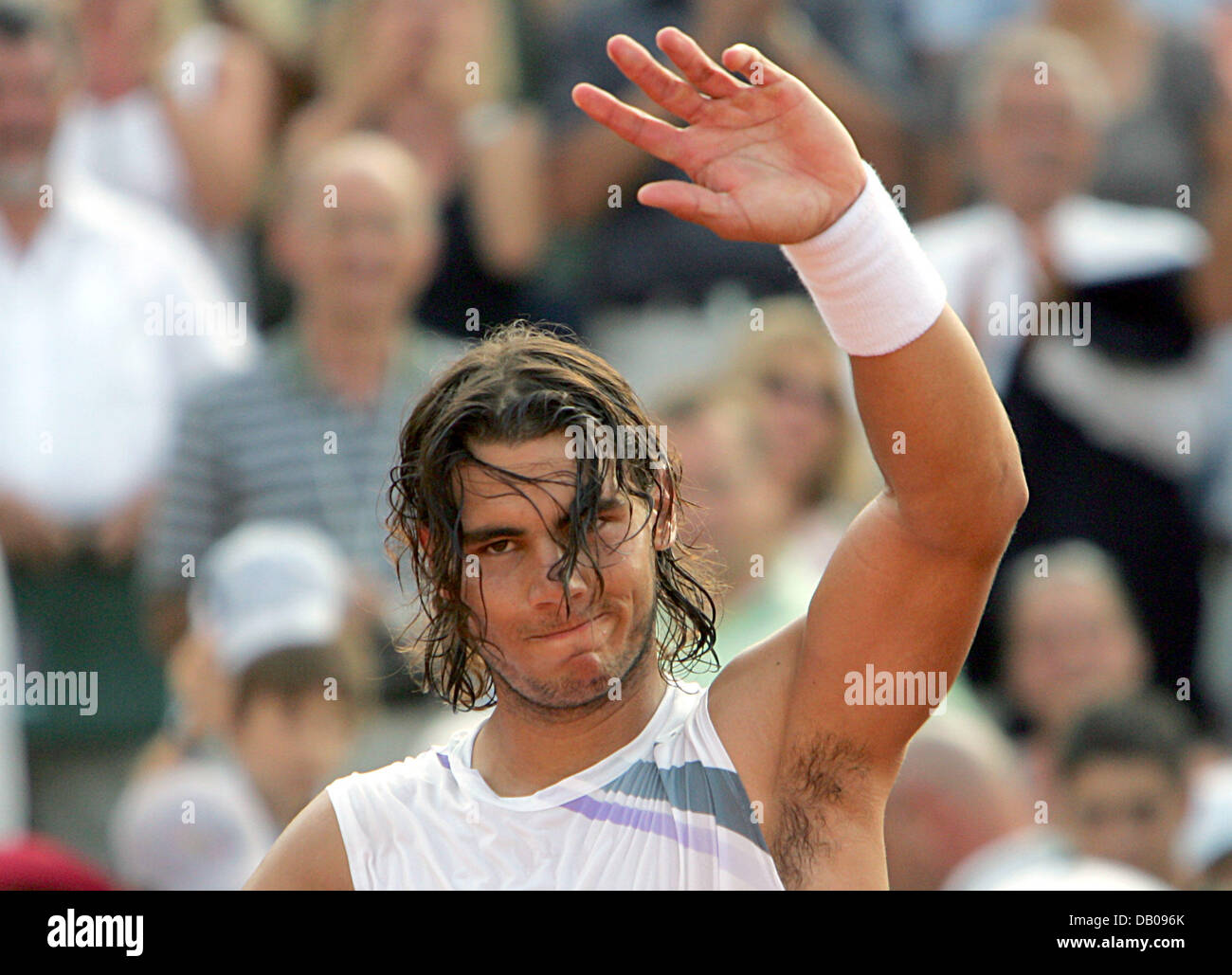 Spanish tennis pro Rafael Nadal greets the crowds after his victory in ...
