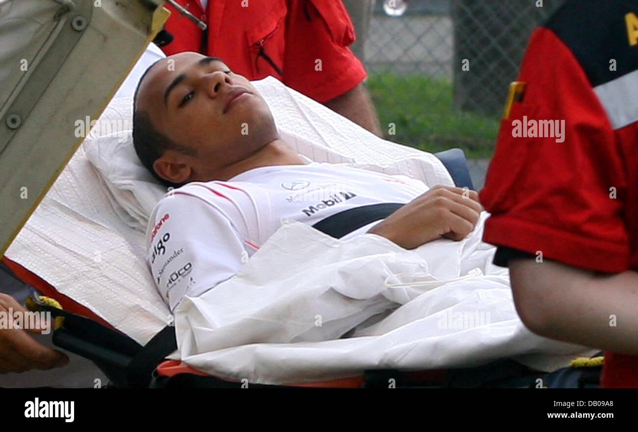 British Formula One driver Lewis Hamilton of McLaren Mercedes lies on a ...