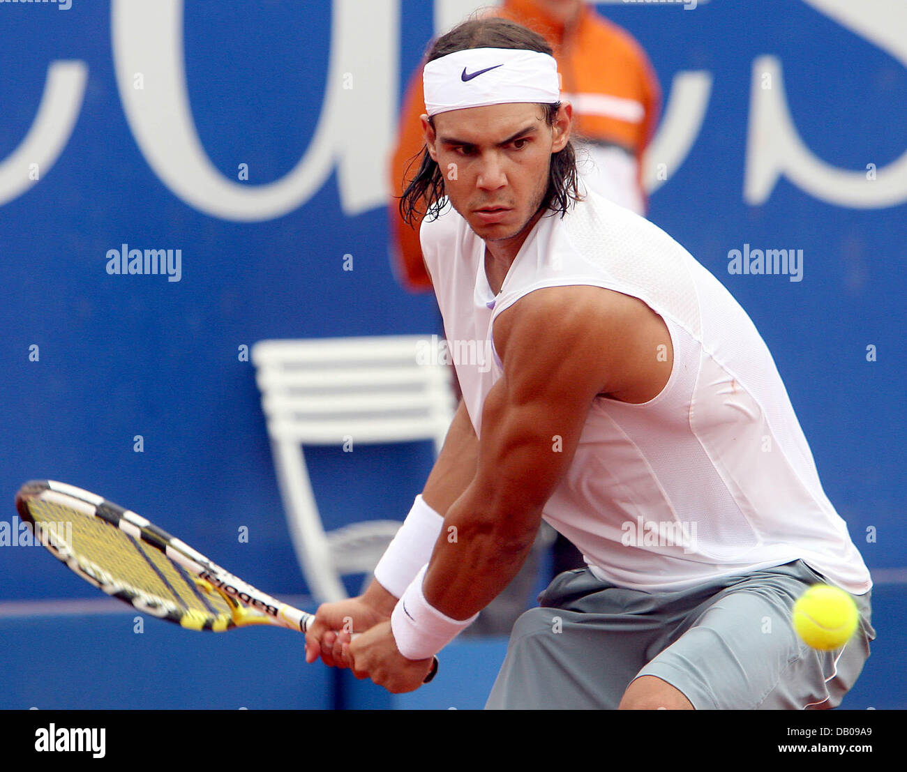 Spanish tennis pro Rafael Nadal hits a backhand shot in his semi final ...