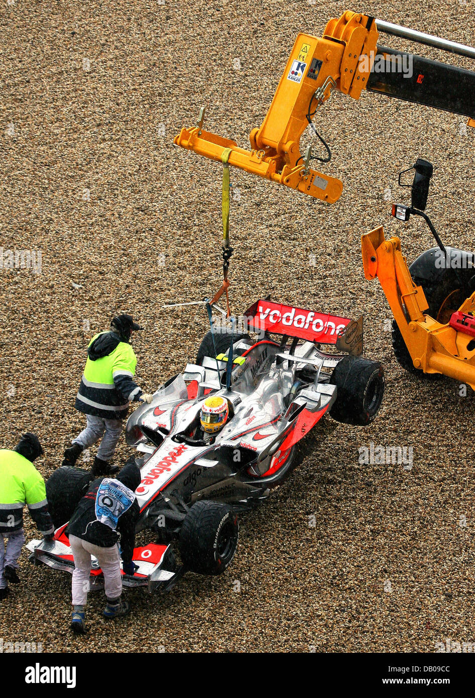 British Formula One pilot Lewis Hamilton of McLaren Mercedes is lifted ...
