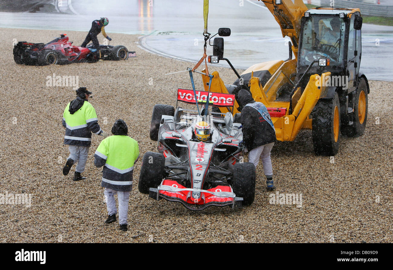 British Formula One pilot Lewis Hamilton of McLaren Mercedes is lifted ...