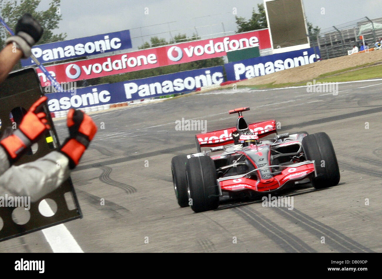 Spanish Formula One pilot Fernando Alonso of McLaren Mercedes waves ...