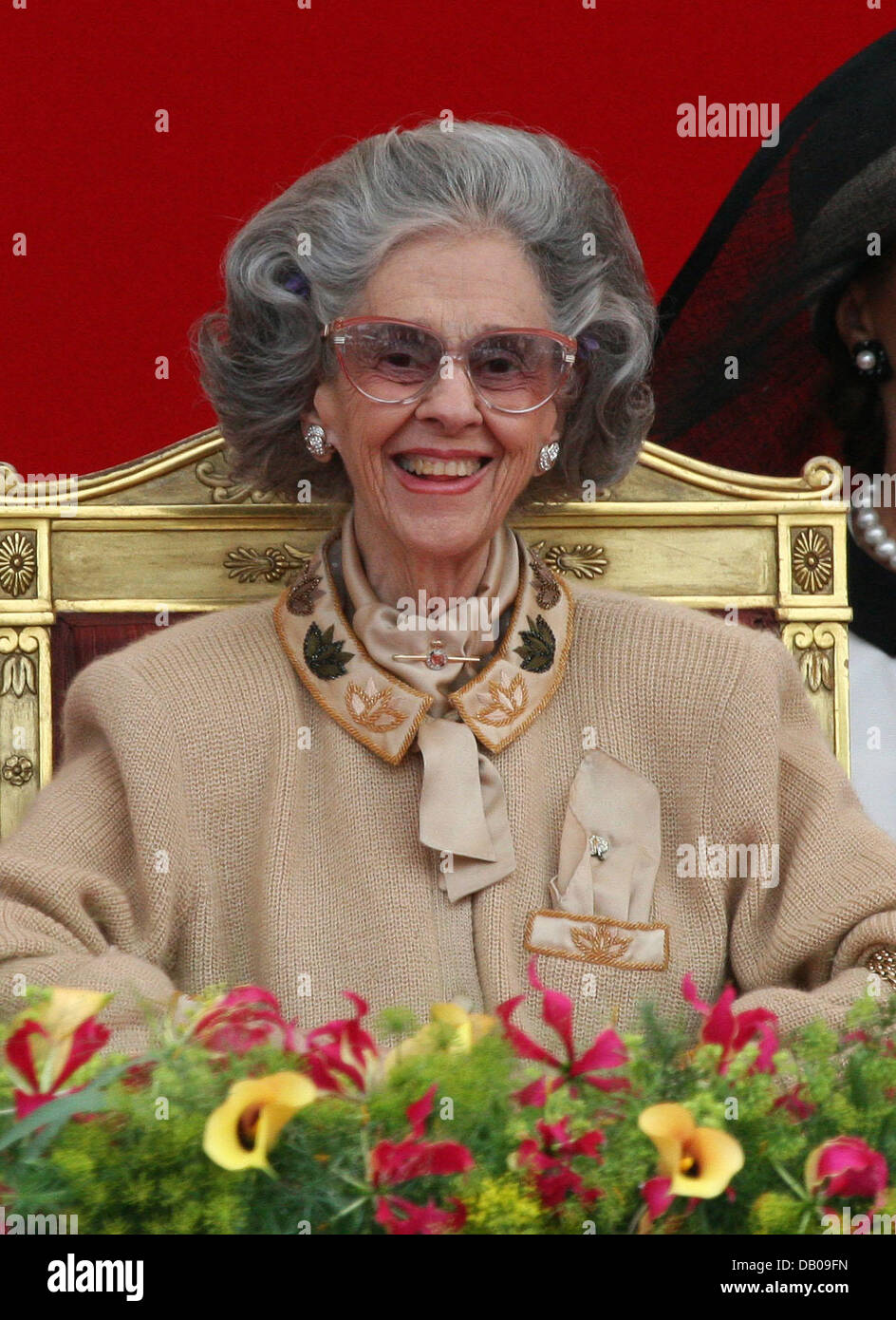 Queen Fabiola of Belgium watches a parade in front of the royal palace ...