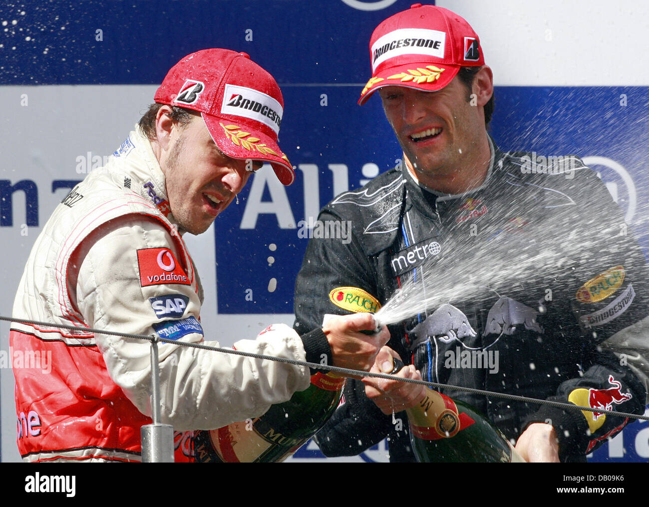 Spanish Formula One driver Fernando Alonso (L) of McLaren Mercedes and ...