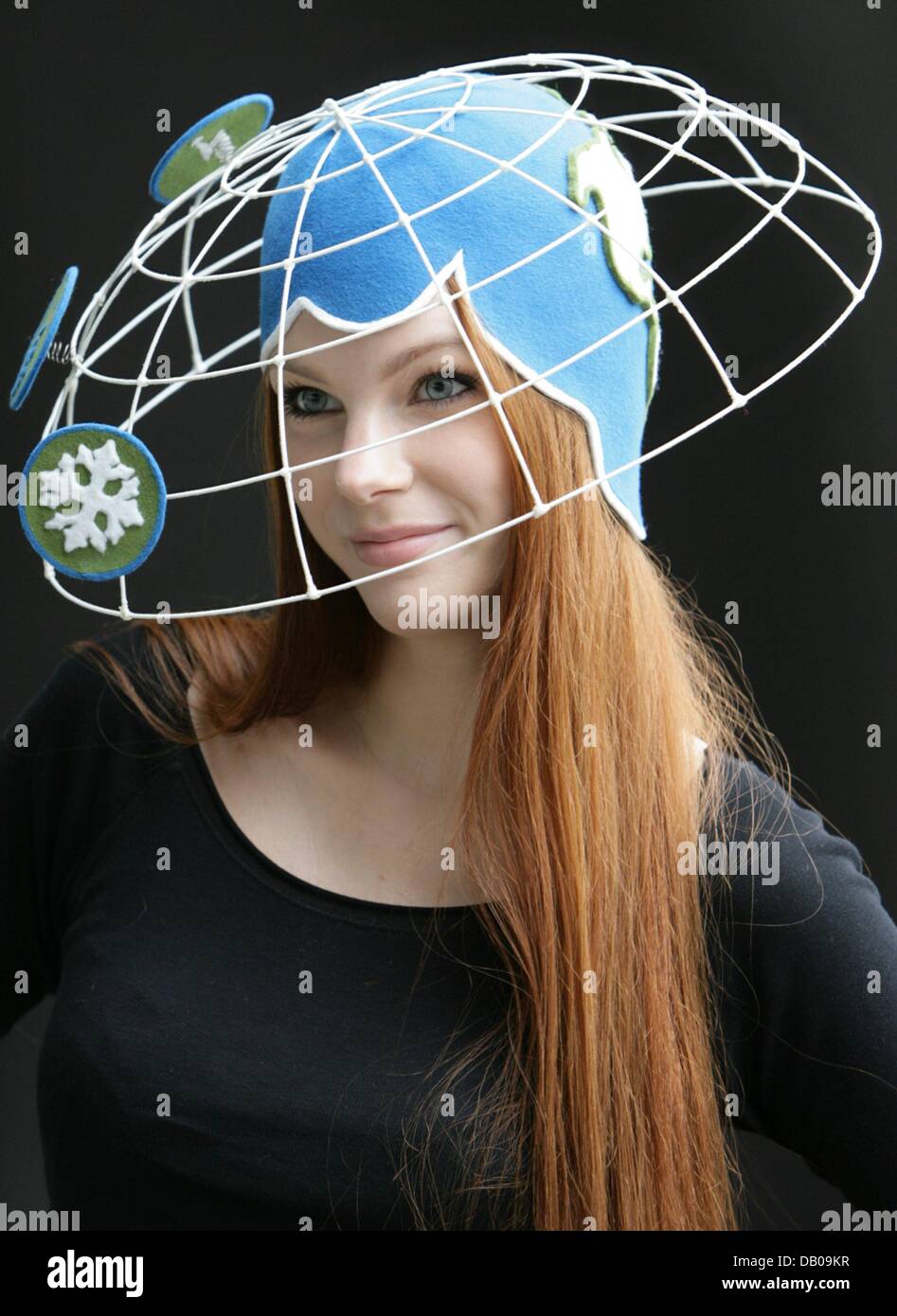 Model Mara poses with the hat creation 'Climate Summit' by Anna ...