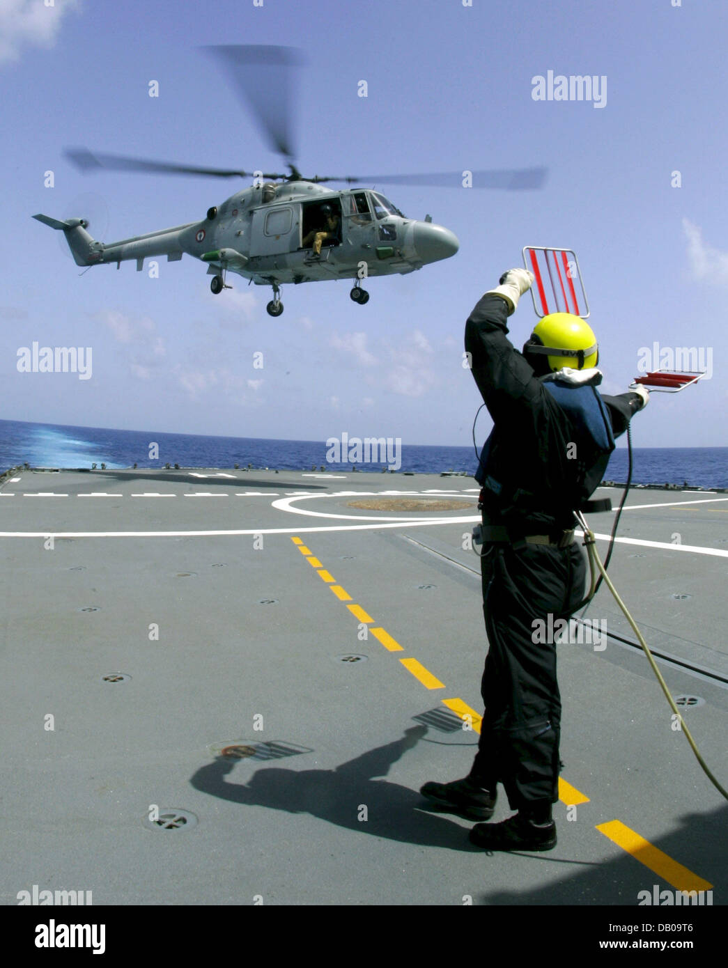 A French helicopter lands on German Navy frigate 'Schleswig-Holstein ...