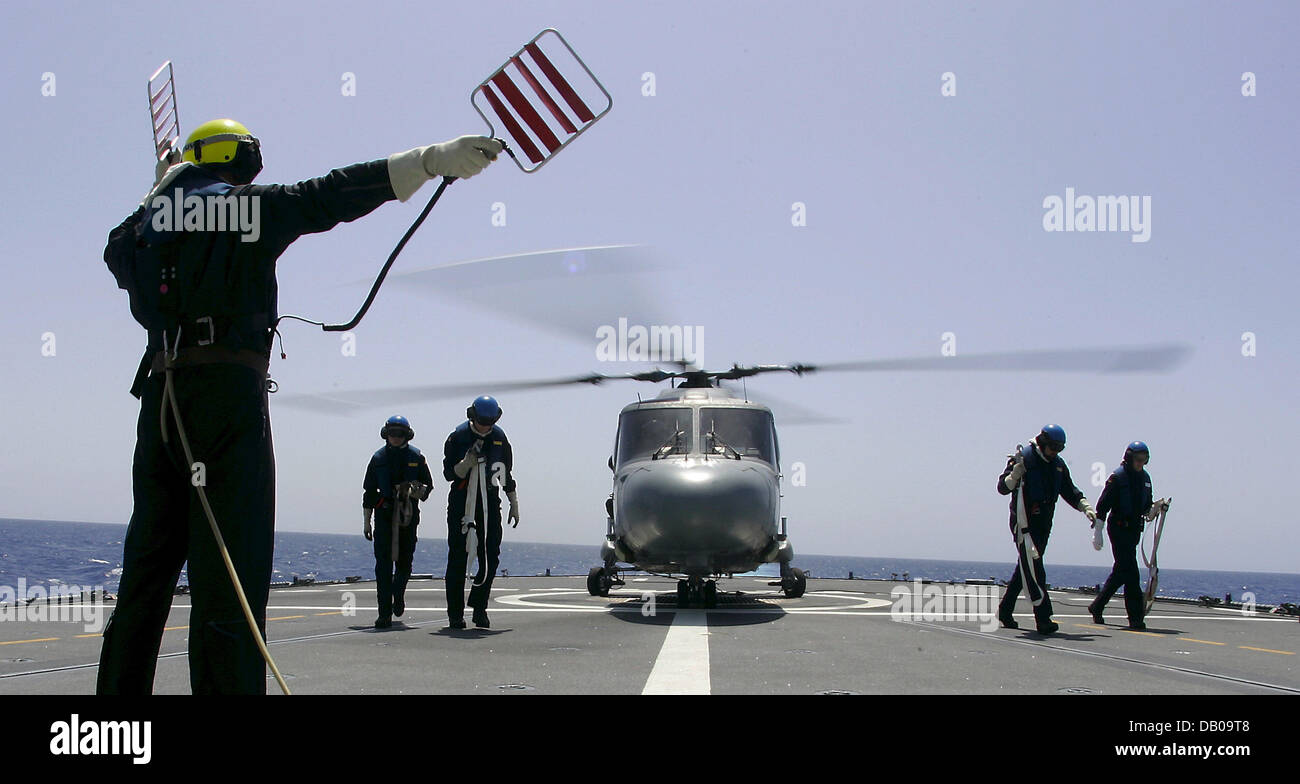 A French helicopter lands on German Navy frigate 'Schleswig-Holstein ...