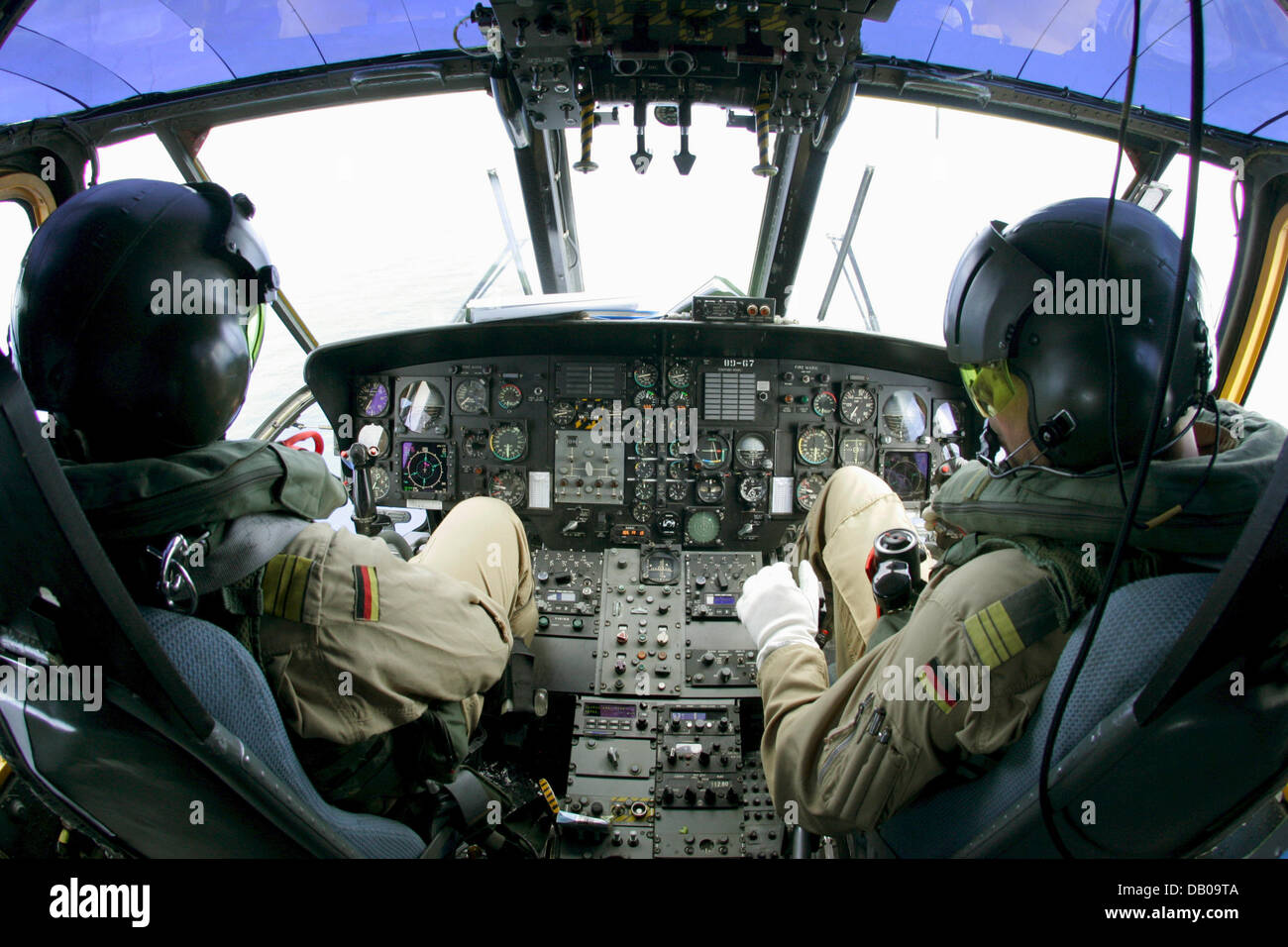 German Navy soldiers fly a helicopter to frigate 'Schleswig-Holstein ...