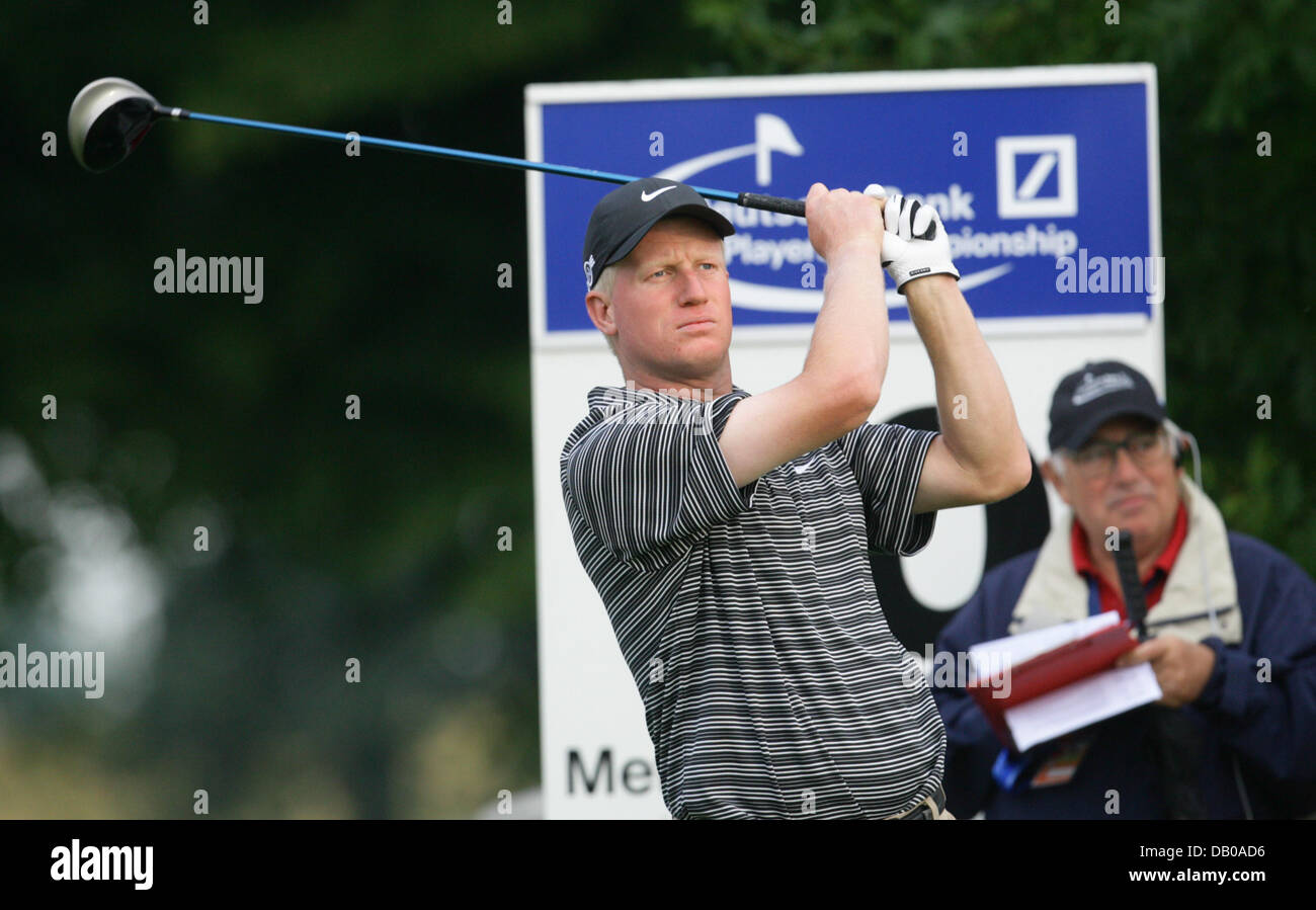 The British golf player Richard Finch observes the trajectory of his ...