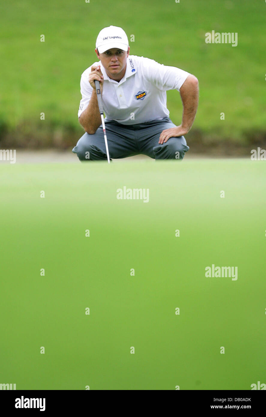 The South African golf player Richard Sterne prepares to putt during ...