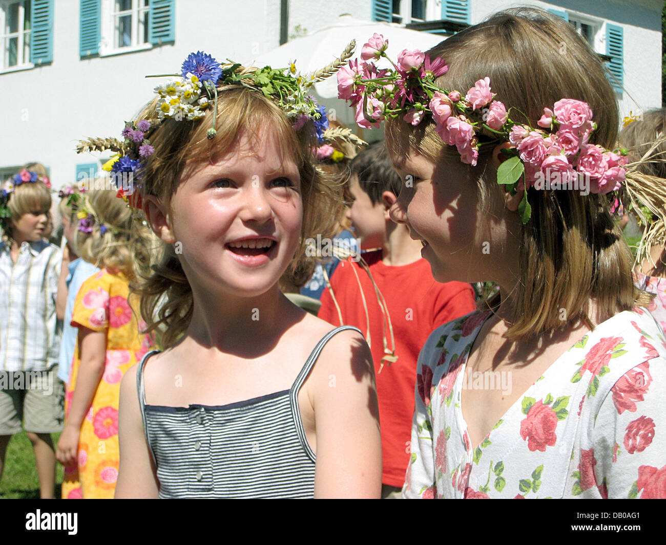 The girls Sophie (L) and Lea talk to each other at the summer ...