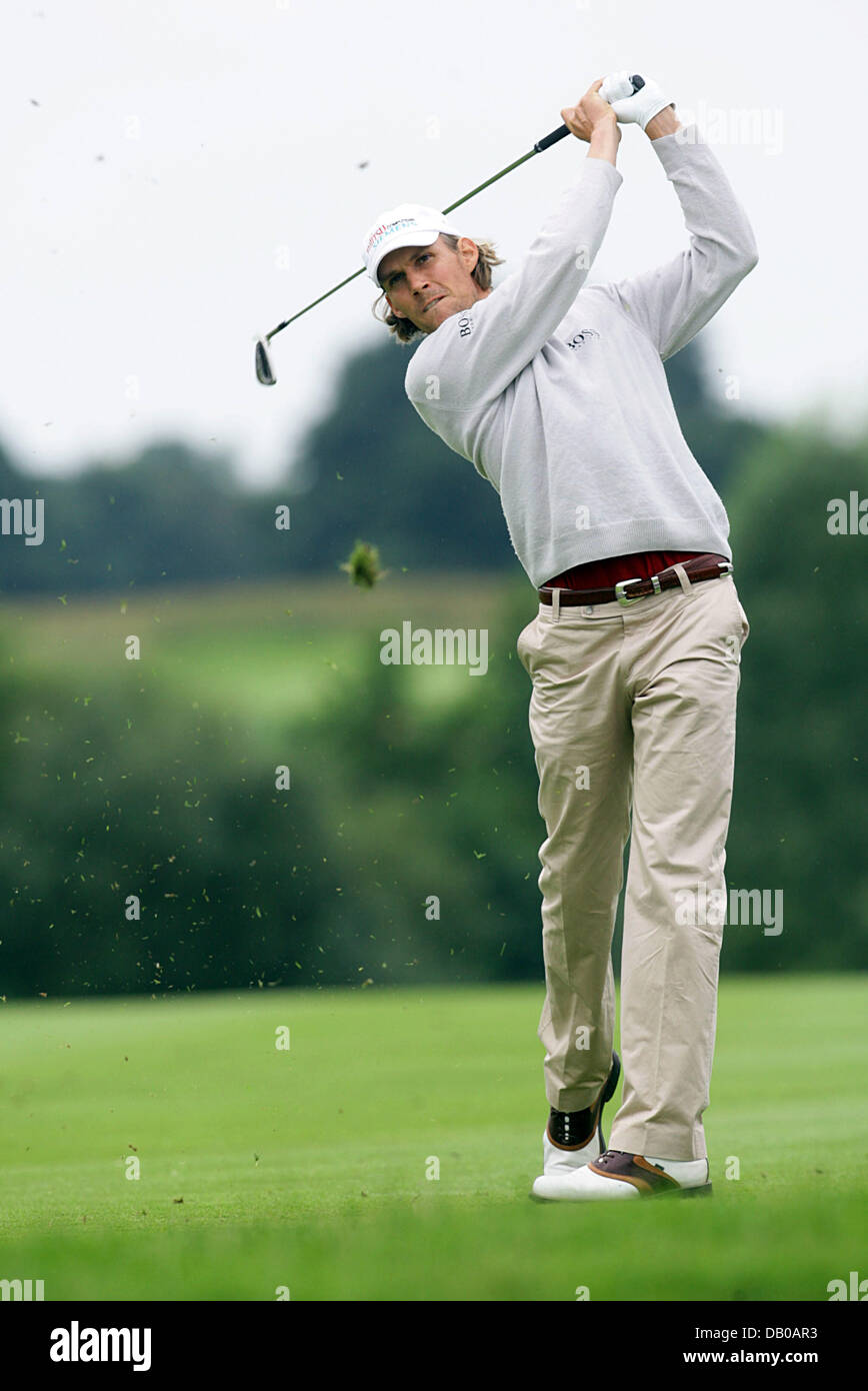 The German golf player Tino Schuster observes the trajectory of his ...