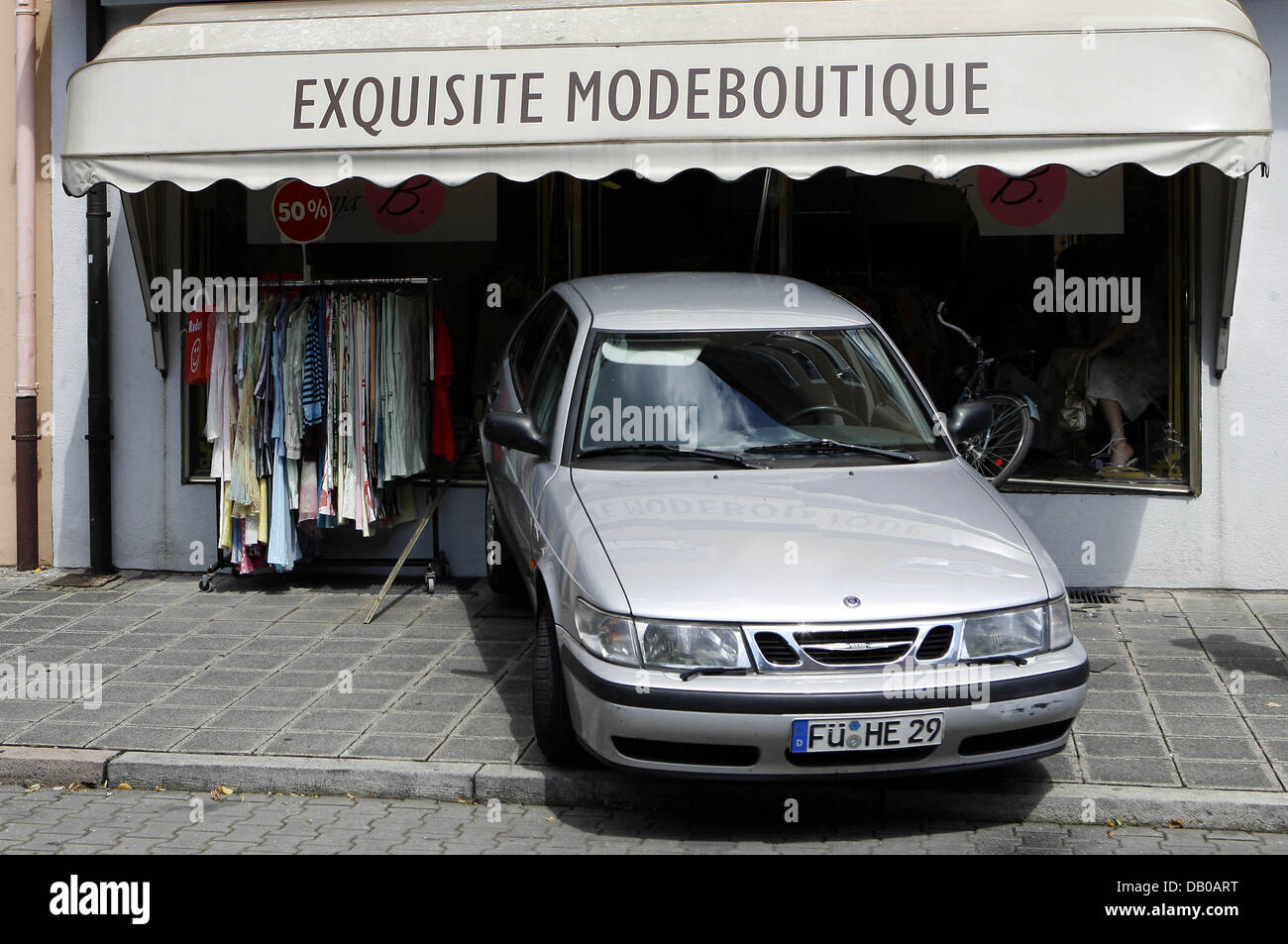 A car parks with the rear end in a display window in Nuremburg, Germany ...