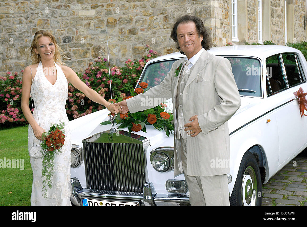 Singer Chris Andrews and his newly-wedded wife Alexandra Andrews pose ...