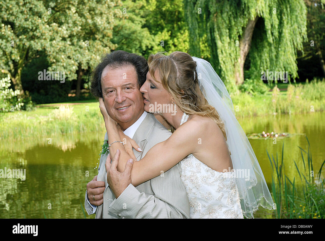 Singer Chris Andrews and his newly-wedded wife Alexandra Andrews pose ...