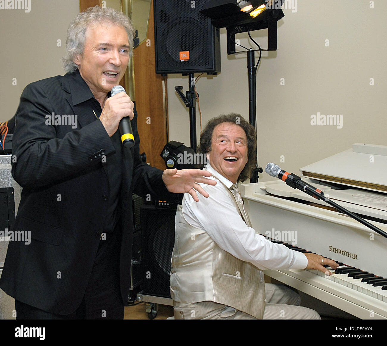 Singer Chris Andrews (R) performs with composer and pop singer Peter ...