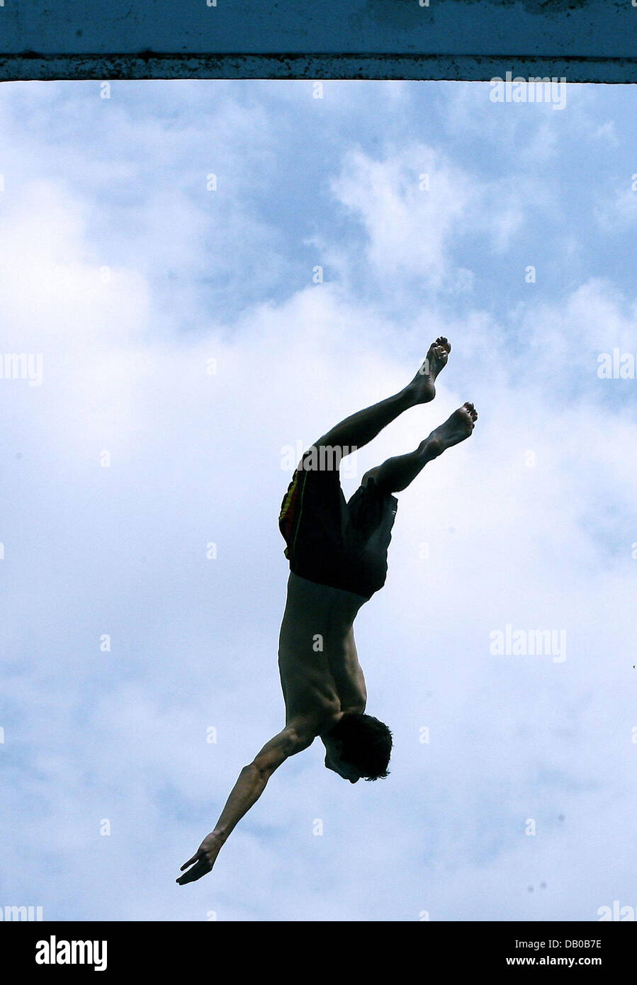 A participant of the Synchron competition jumps into the pool at the ...