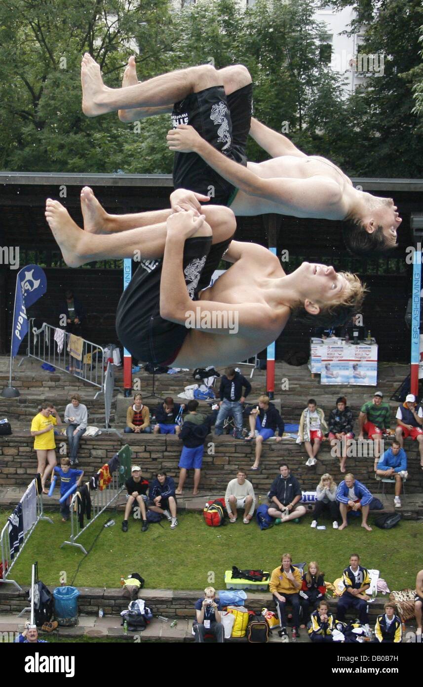 Participants of the Synchron competition jump into the pool at the ...