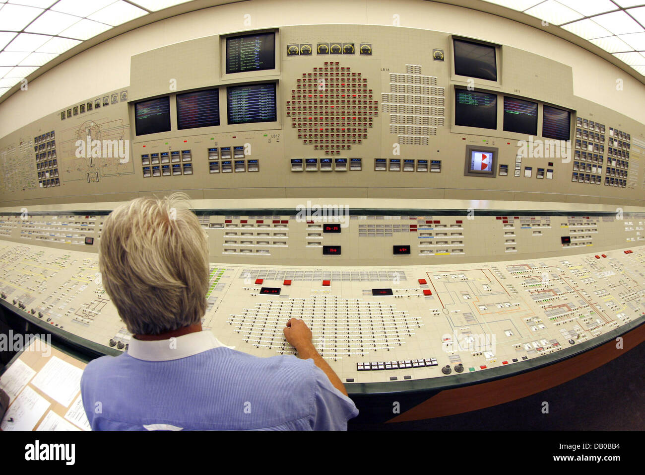 Kai Detlefsen, coach for reactor operators sits in an exact simulator ...
