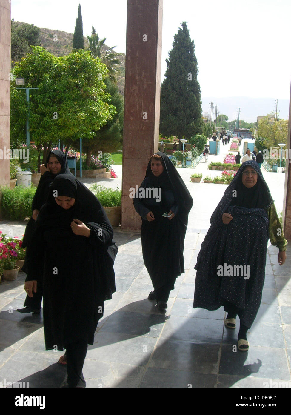 Women dressed in traditional chadors are pictured at the gravesite of ...