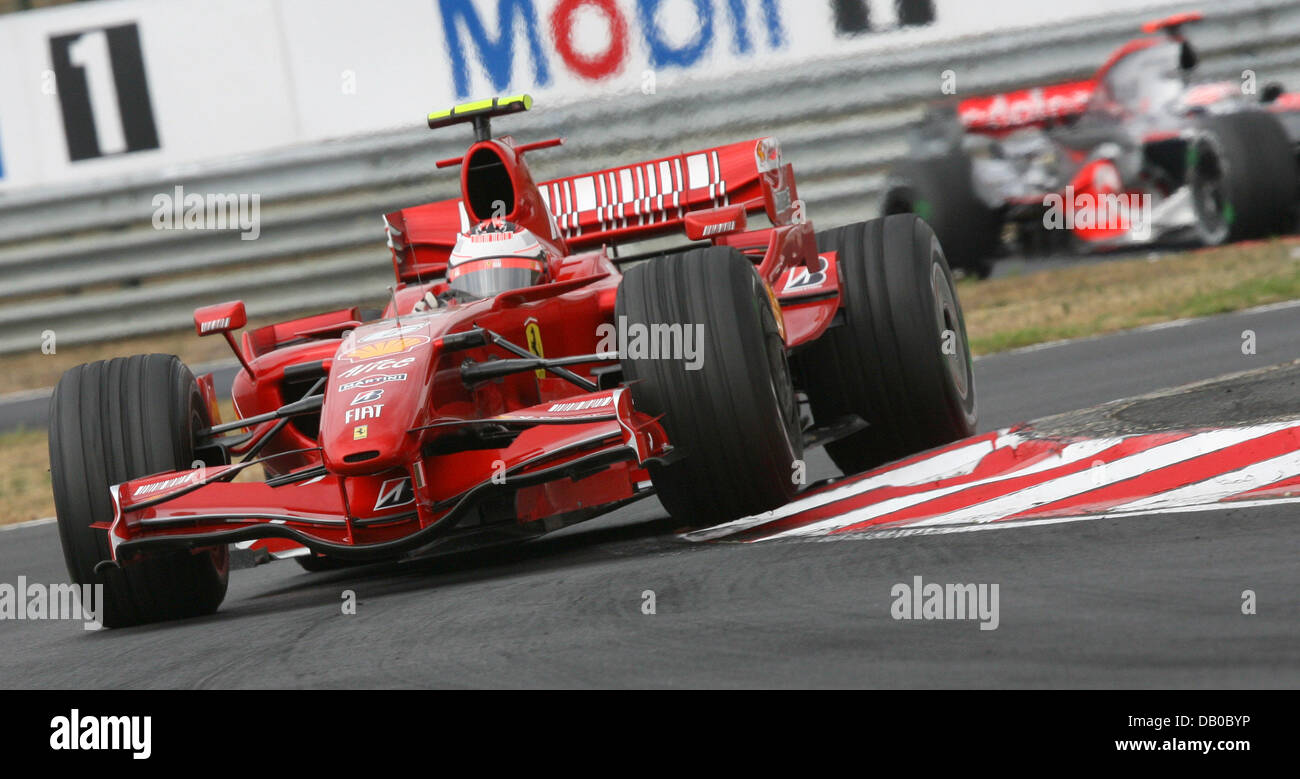 Finnish Formula One driver Kimi Raikkonen of Scuderia Ferrari (L) in ...