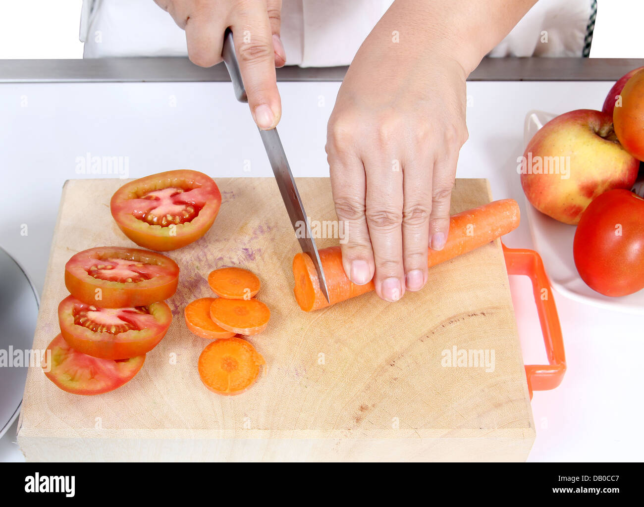 Woman cutting carrot hi-res stock photography and images - Alamy