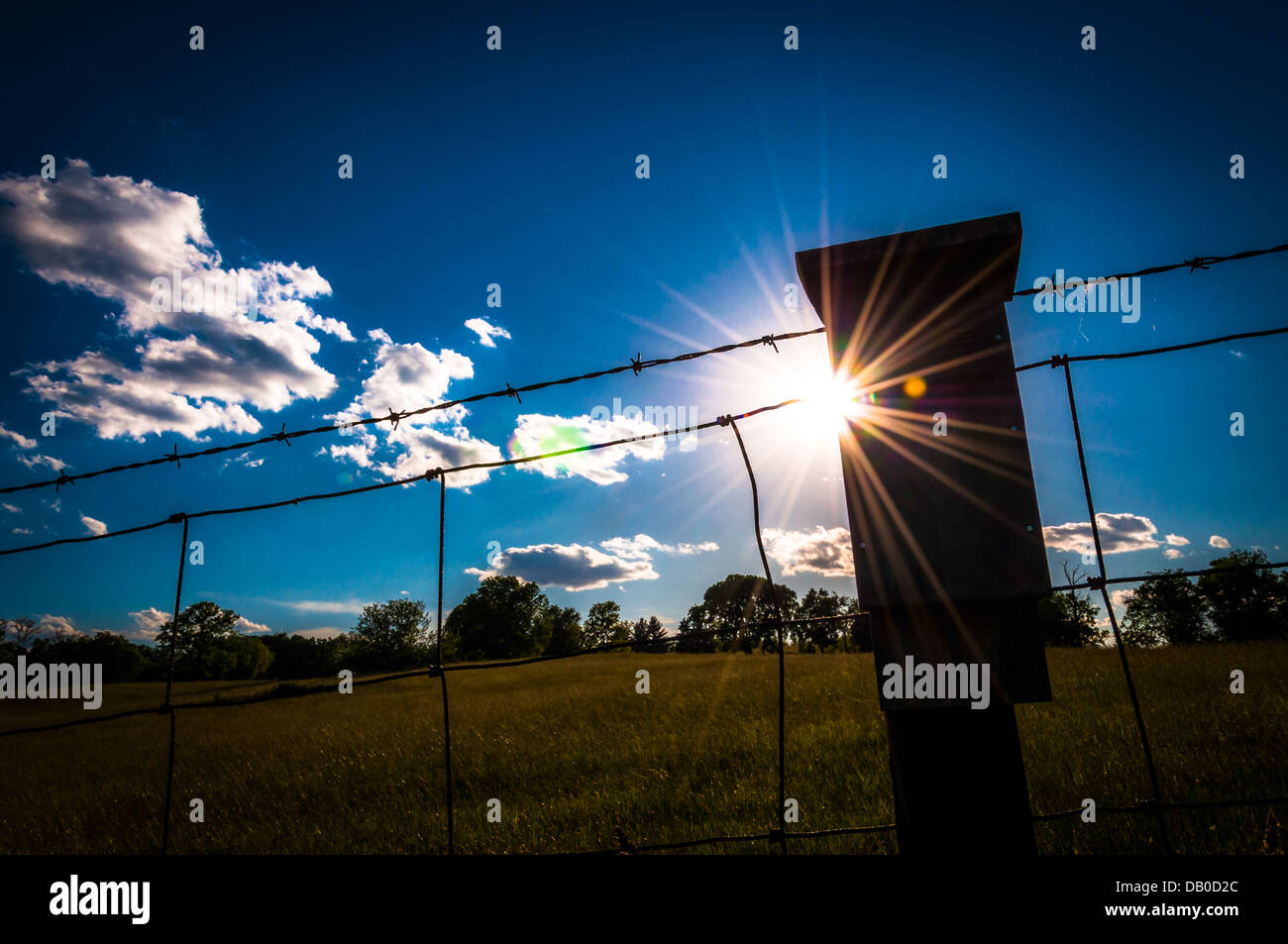 Sun rays through a fence hi-res stock photography and images - Alamy