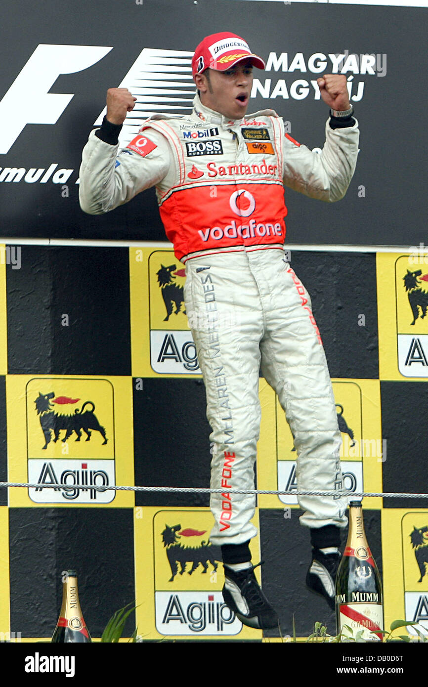 British Formula 1 driver Lewis Hamilton of McLaren Mercedes jumps off ...