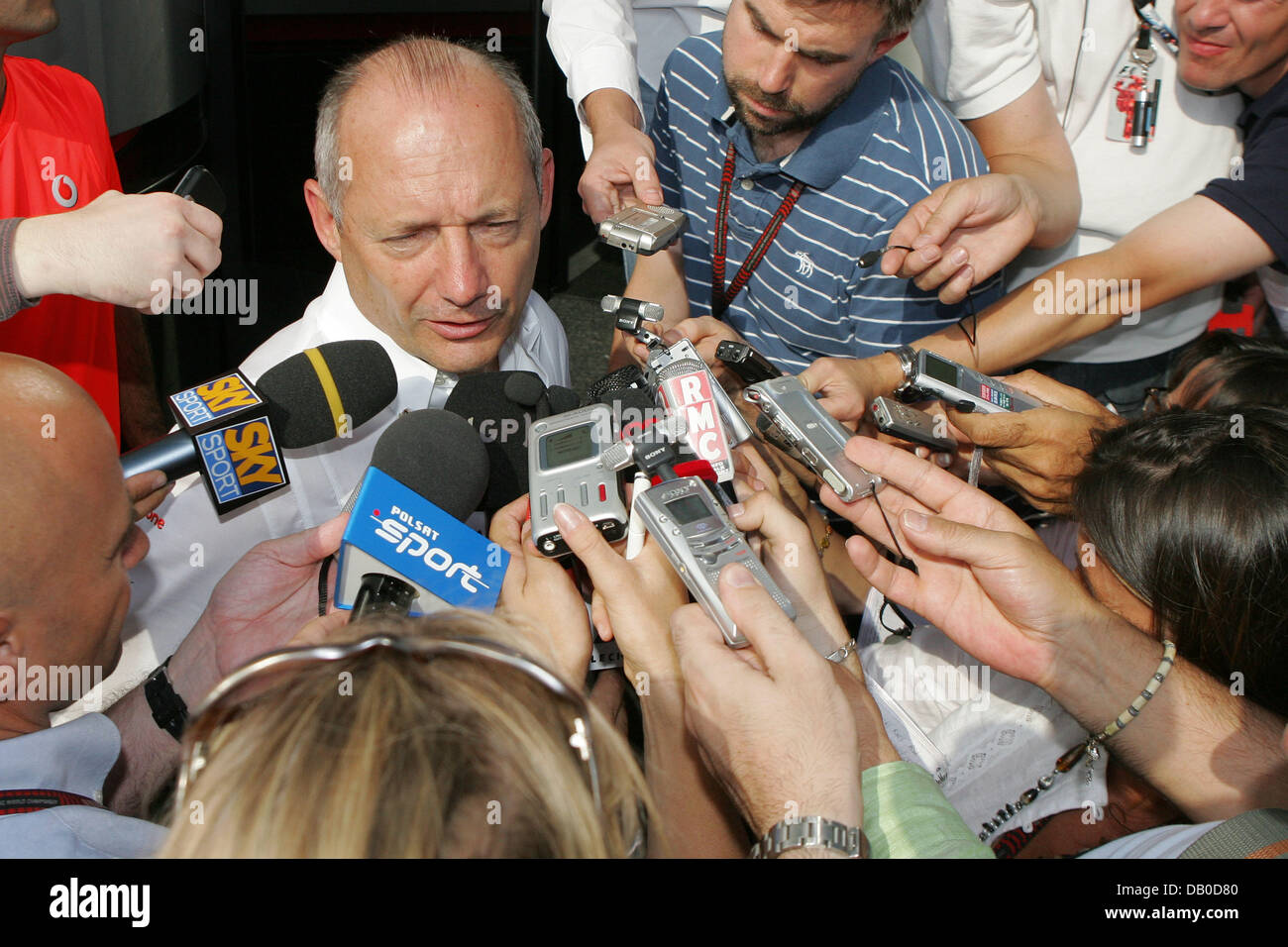 McLaren team principle Ron Dennis talks to reporters during the Formula ...