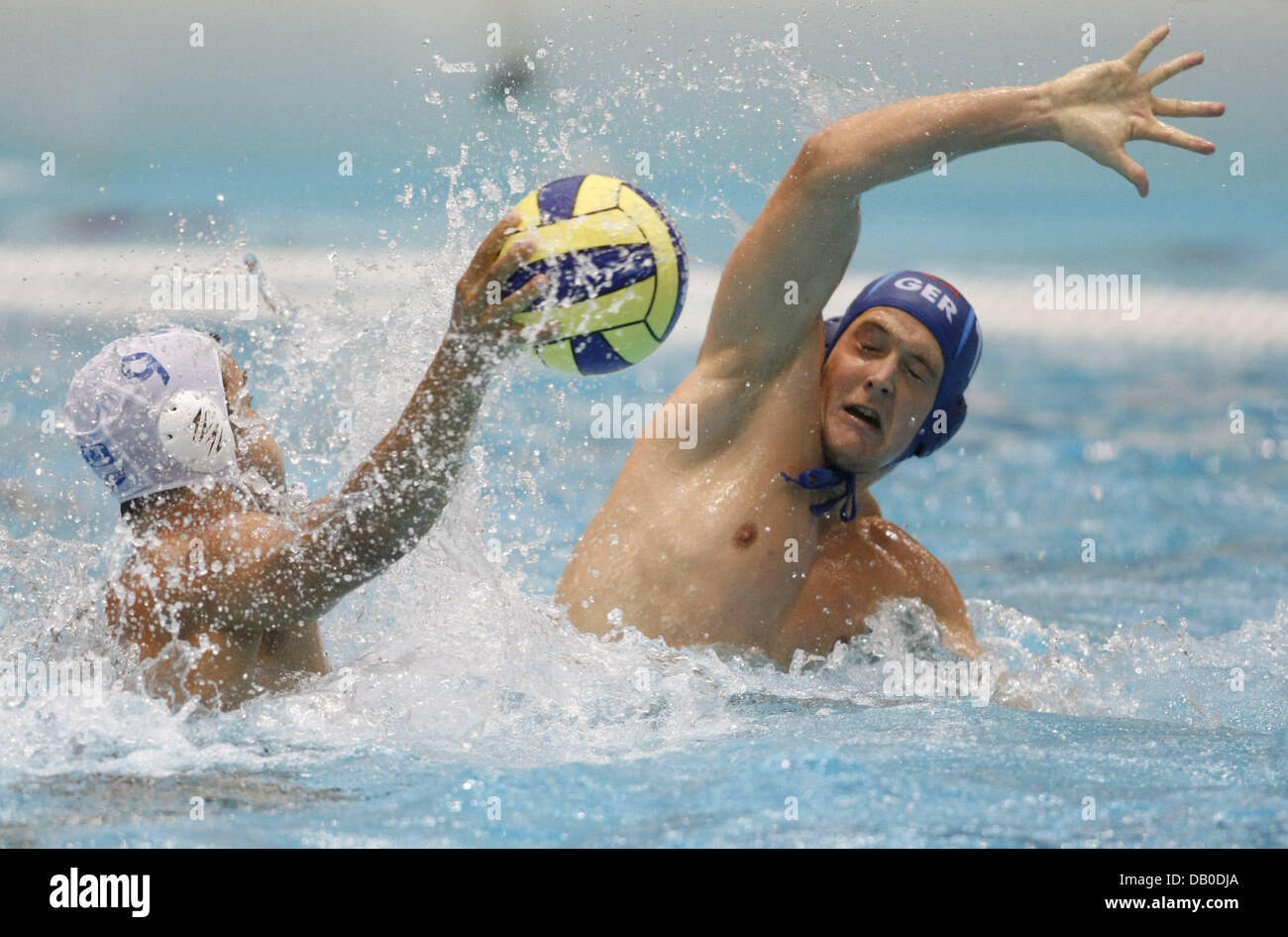 German player Heiko Nossek (R) and Canadian Aaron Feltham vie for the ...