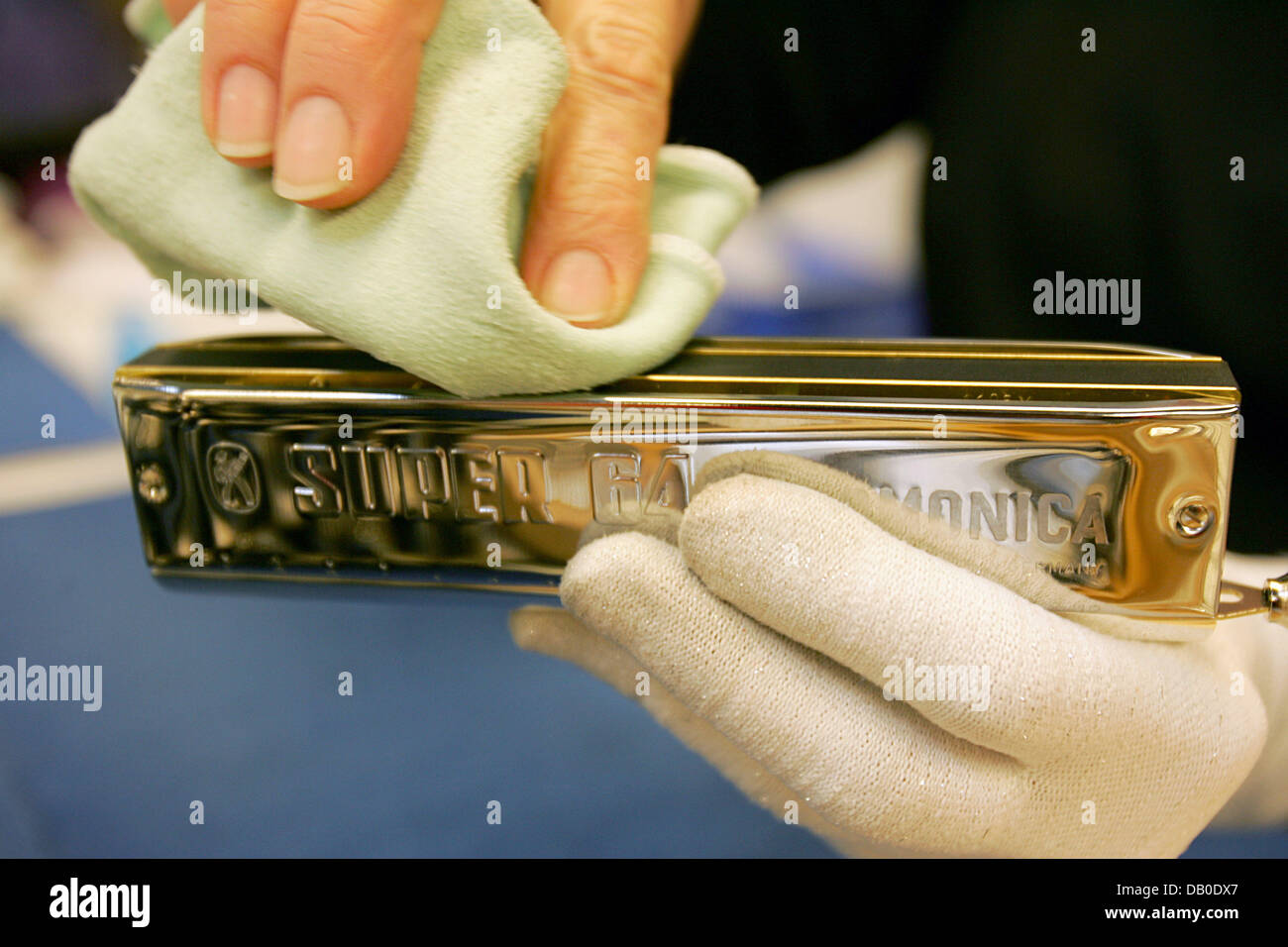 The picture shows production procedures of harmonicas by manufacturer ...