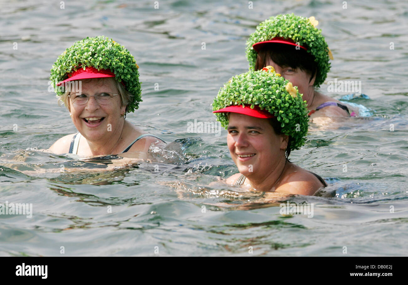 Three female participants of the 7th Outdoor Aqua Running event shown ...