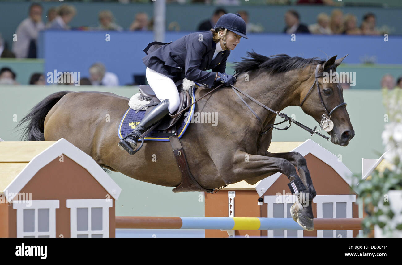Swedish Lotta Schultz and her horse 'Calibra II' are pictured midair as ...