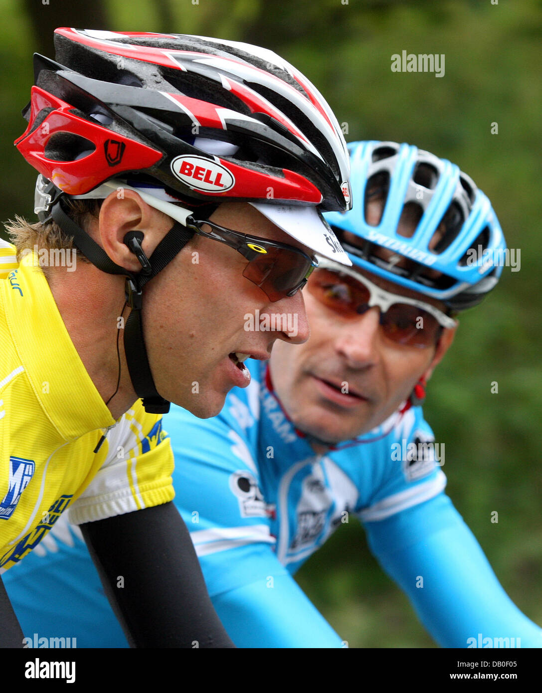 German cyclist Jens Voigt (L) of Team CSC wears the Yellow Jersey as he ...