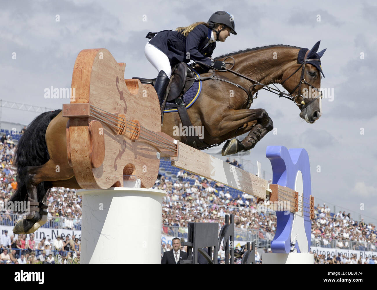 Helena Lundbaeck and her horse Madick overcome an obstacle during the ...
