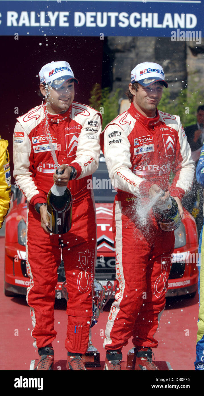 The current German rallye world champions Sebastien Loeb (R) and co ...