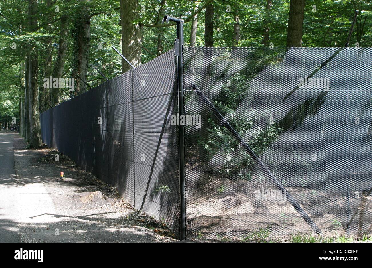 The picture shows the fence around Drakenstein castle and its park near ...