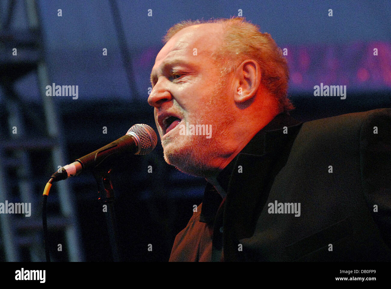 British rock singer Joe Cocker sings during an open air show in ...