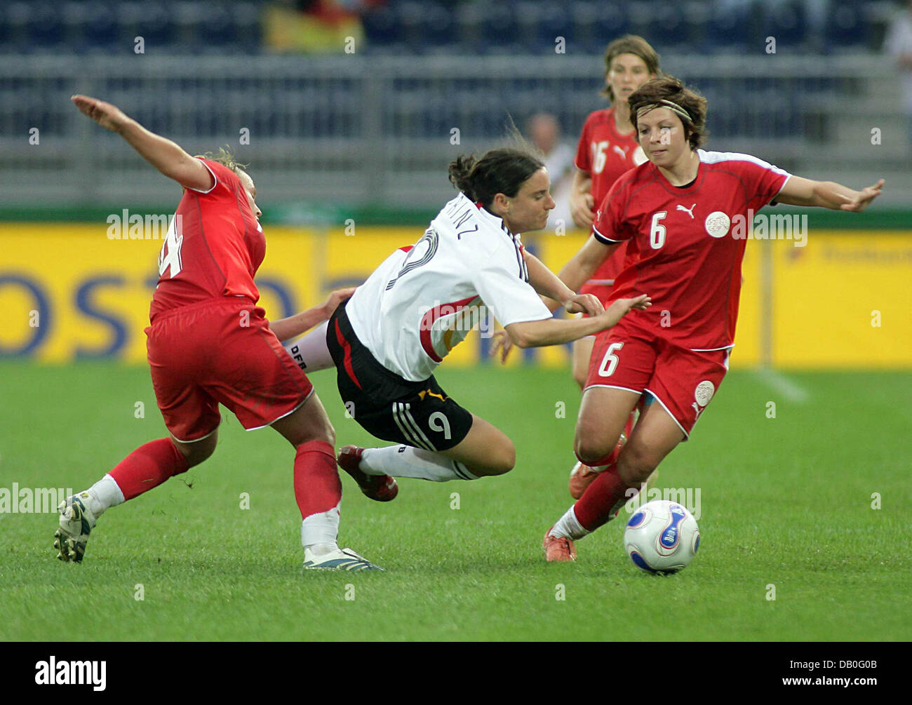 Germany's Birgit Prinz (C) and Switzerland's Noemie Beney (L) and ...