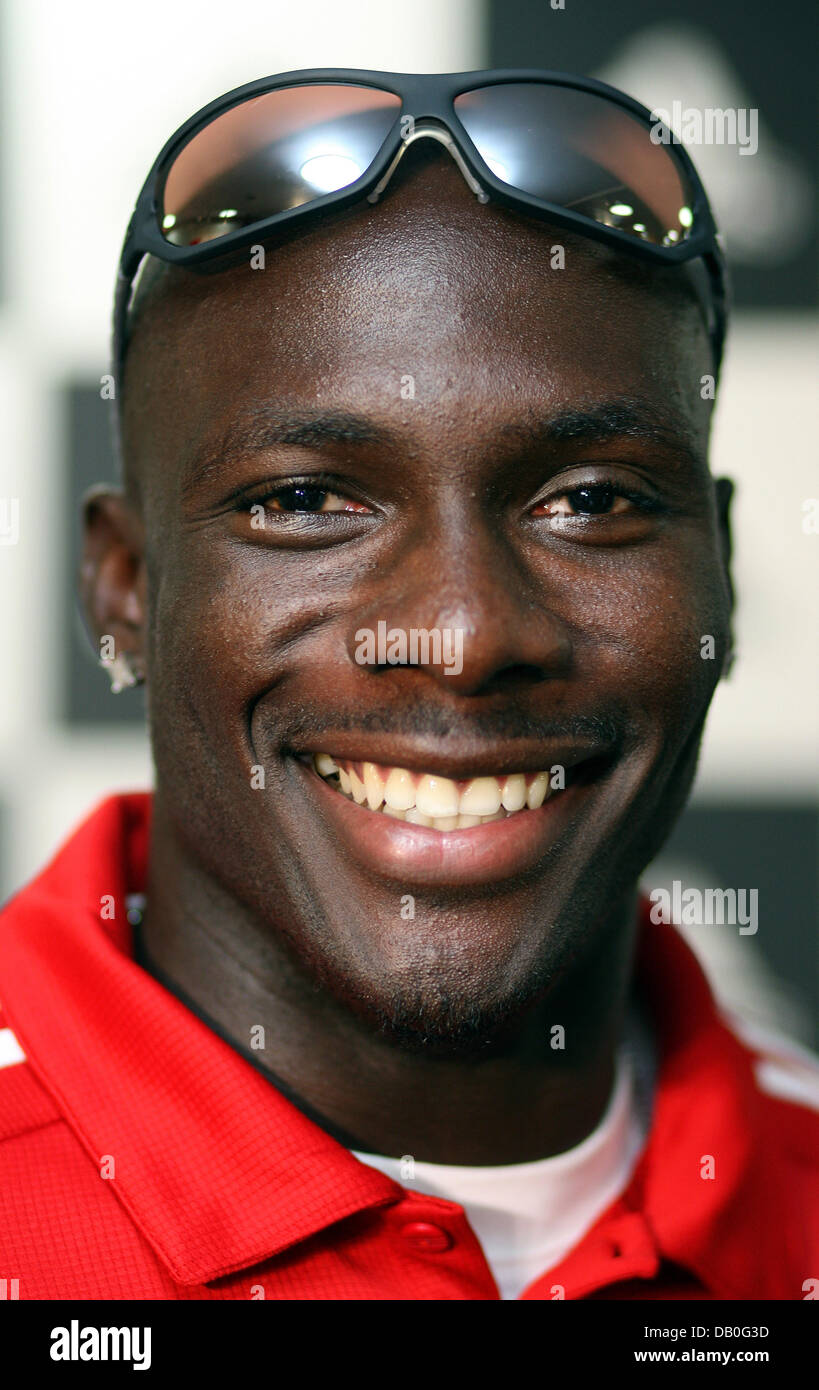 Sprinter Derrick Atkins from the Bahamas smiles during a spnonsor's ...