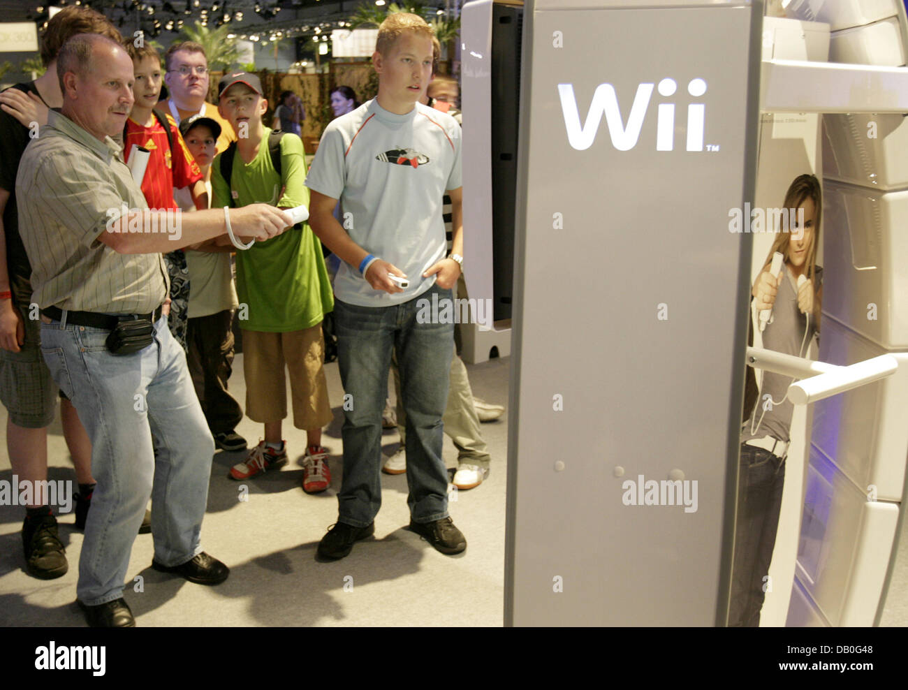 Visitors play a Wii gaming console, promising easy handling, movement ...