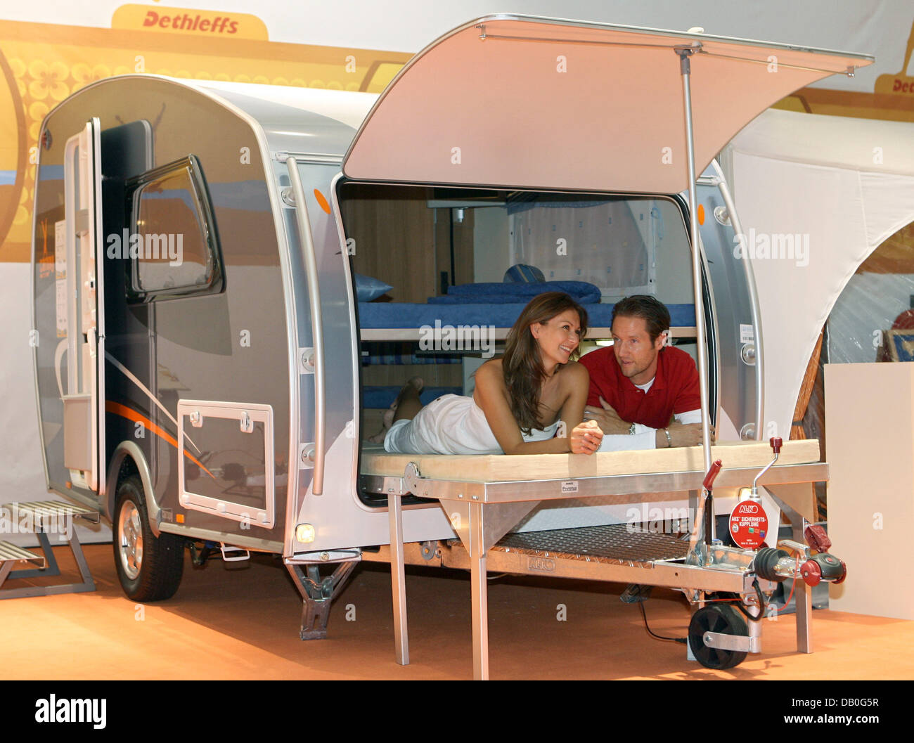 (L-R) Sylwia and Bernd pose in a camper during a photo call for the ...