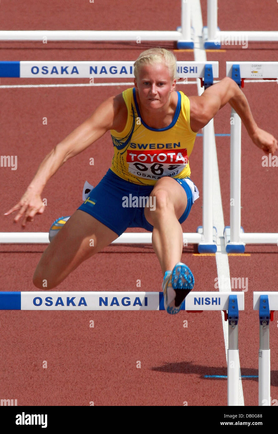 Swedish heptathlete Carolina Klueft takes a hurdle in the Heptahlon ...